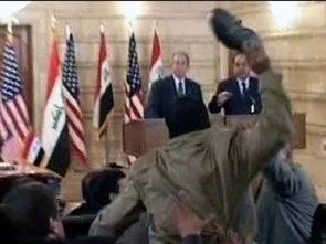 Painting on Bush shoe throwing incident hits record at Doha auction