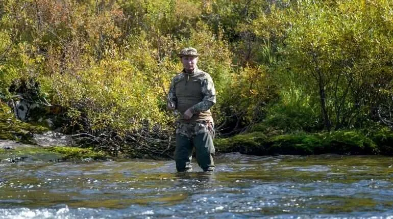 Kremlin releases photos of Vladimir Putin hiking and fishing in Siberia