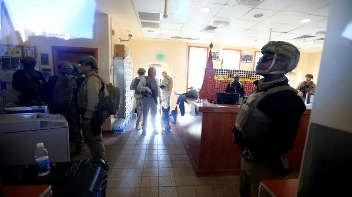 US embassy guards in Baghdad fire stun grenades at protesters