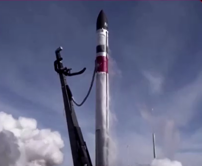 Rocket Lab captures rocket booster with helicopter, then drops it